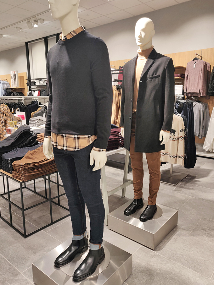 Mannequins modeling the art of layering&mdash;that Burberry-inspired plaid peeking out says "I'm worth it" while the outlet price whispers "bargain."