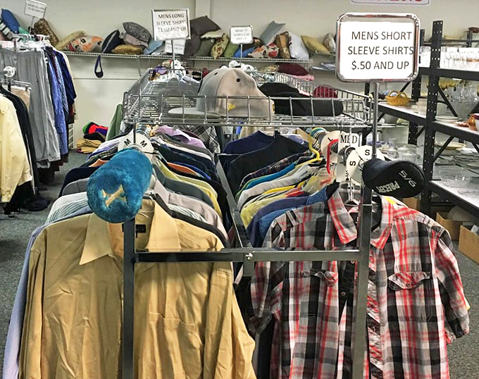 Men's shirts hanging like colorful soldiers at attention. That plaid number is practically begging for a backyard barbecue invitation. 