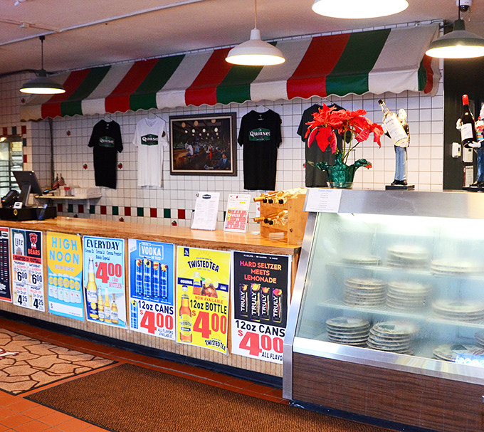 The Italian flag awning says what words don't need to: authentic flavors live here. Merchandise for those who want to take the memory home.