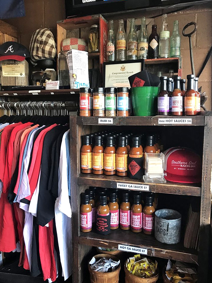 Sauce bottles lined up like soldiers ready for duty, with merch that lets you take the Southern Soul experience home.