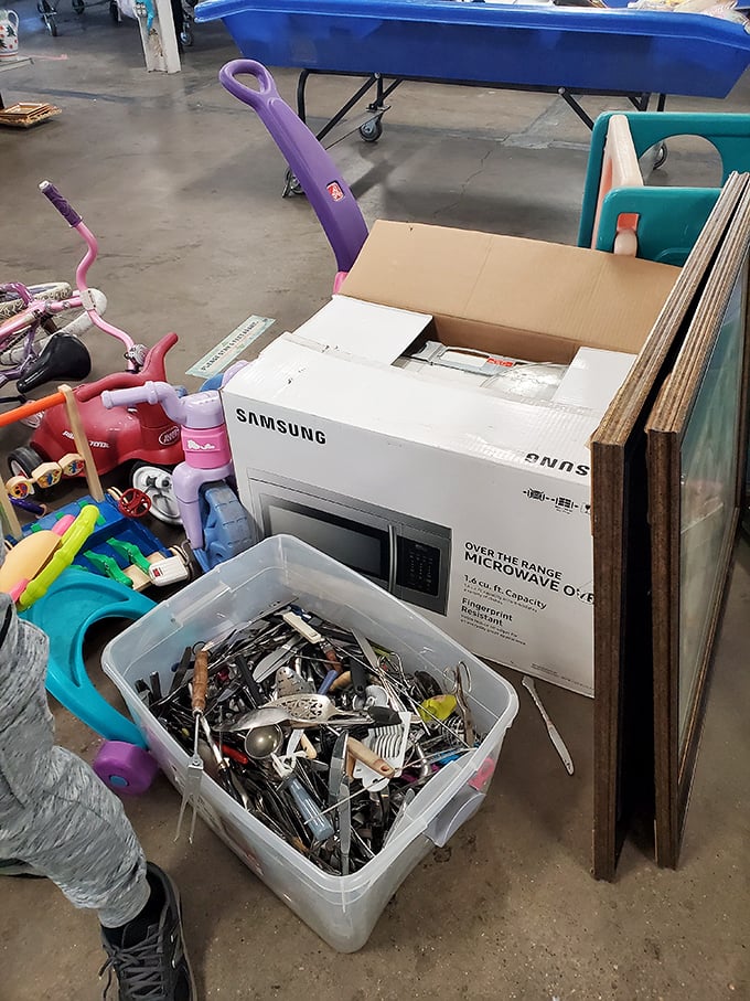 Childhood dreams and kitchen necessities coexist in this corner of controlled chaos&mdash;a purple wagon handle reaches skyward like a flag.