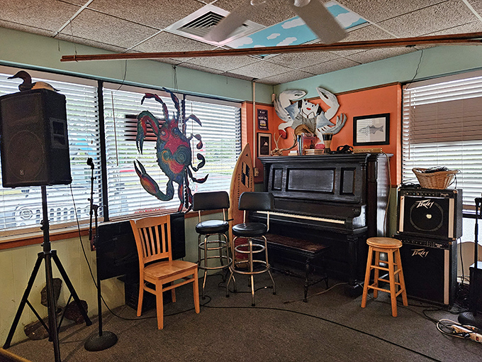 The music corner waits for evening entertainment, while that painted crab on the wall looks ready to break into song himself.