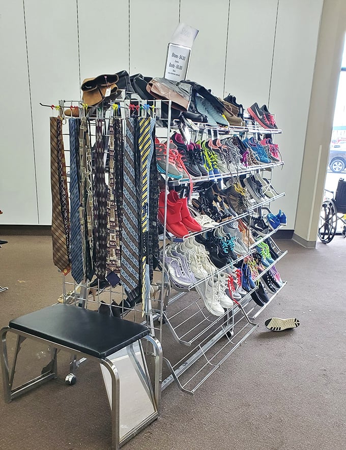 Ties, sunglasses, and athletic shoes share shelf space in a beautiful chaos that somehow makes perfect sense.