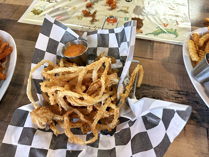 Onion rings should be architectural wonders—crispy, light, and structurally sound. These golden halos check all the boxes.