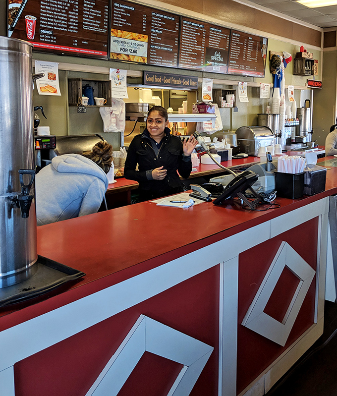 At the counter, where barbecue dreams become reality, friendly faces guide you through decisions that will impact your happiness for hours to come.
