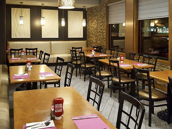 Modern lighting meets classic diner layout, creating an atmosphere where both your Instagram feed and your nostalgia for simpler times can thrive simultaneously.