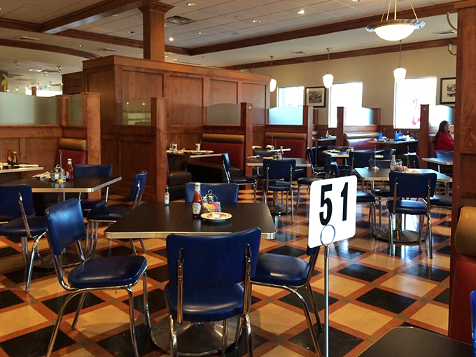 The dining room's checkerboard floor and booth seating create that perfect blend of nostalgia and comfort we all secretly crave.