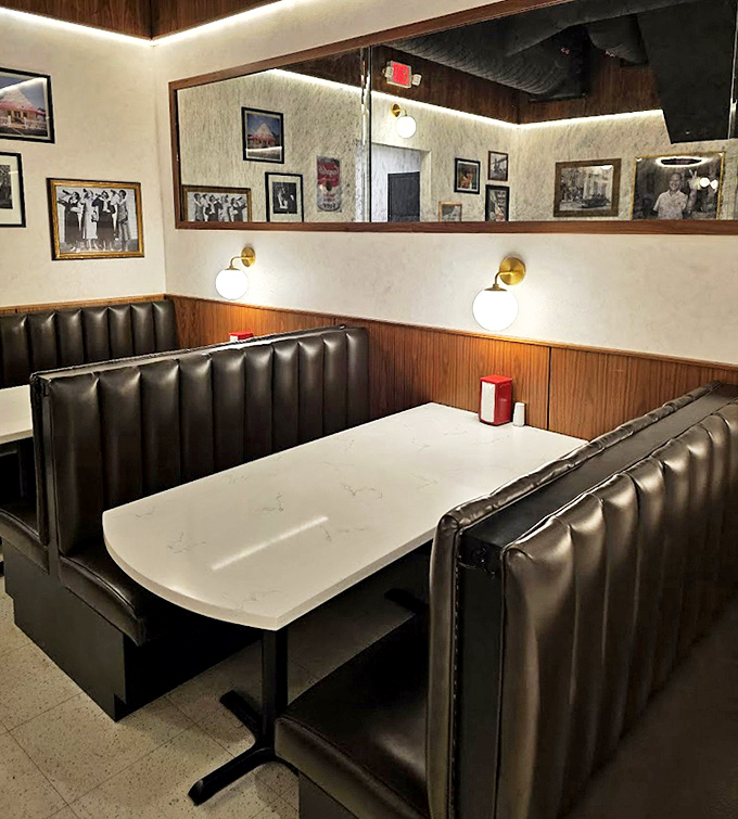 Cozy booths invite intimate conversations over comfort food, while vintage photos remind you that good eating is timeless.