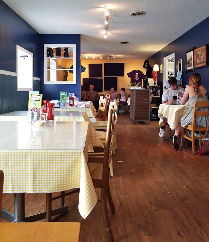 Blue walls, yellow accents, and checkered tablecloths&mdash;a color scheme that says "good morning" before the coffee even arrives.