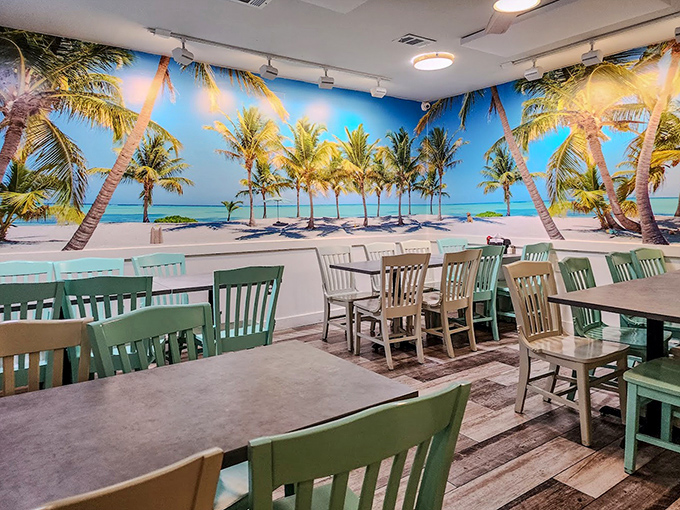 Beach vibes abound with this stunning wall mural transporting diners to paradise. Who needs a window view when you've got palm trees and turquoise waters surrounding you?