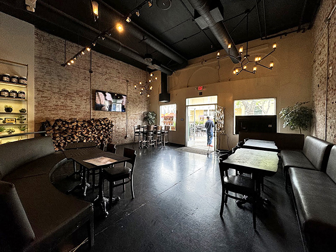 The dining room's exposed brick and warm lighting create the kind of atmosphere where you'll want to linger long after the last slice disappears.