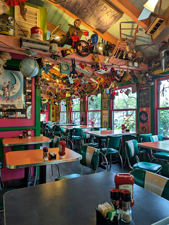 The dining room feels like eating inside a kaleidoscope designed by Willy Wonka. Retro tables anchor you amid the delightful chaos.