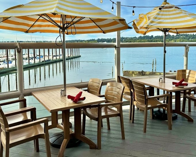 Dining al fresco with yellow umbrellas and marina views&mdash;because sometimes the best seasoning is sunshine and a gentle river breeze.