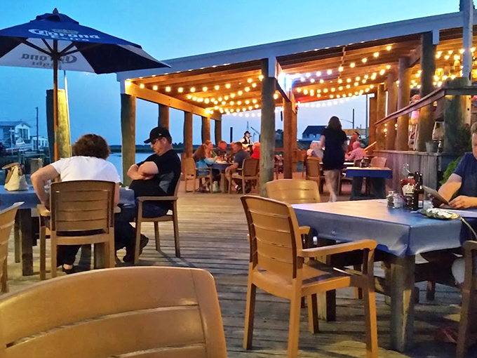 Outdoor dining under string lights transforms a regular meal into an evening where everything tastes better with fresh air involved.
