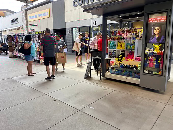 Kiosks and outdoor seating areas create community spaces between shopping sprints, where tired feet rest and shopping strategies are recalibrated.