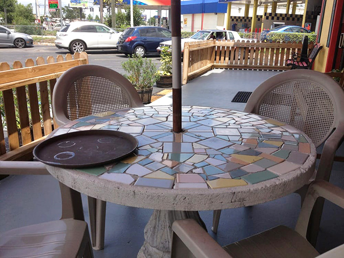 Outdoor seating with mosaic charm&mdash;where Florida's sunshine becomes an unofficial ingredient in every meal.
