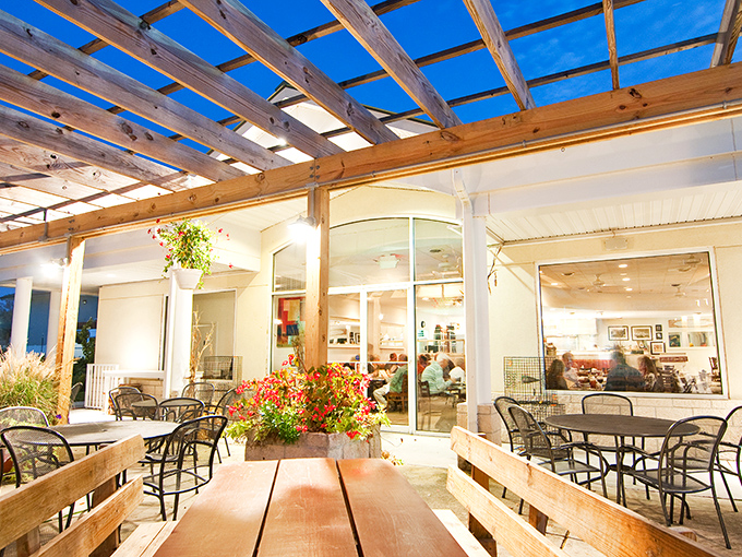 The outdoor patio offers al fresco dining under wooden beams. Summer evenings were made for spaces exactly like this.