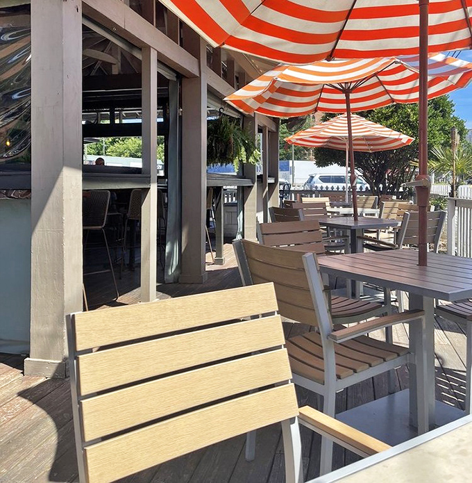 Outdoor seating that captures that vacation feeling. Those striped umbrellas practically demand you order something with a tiny paper parasol.