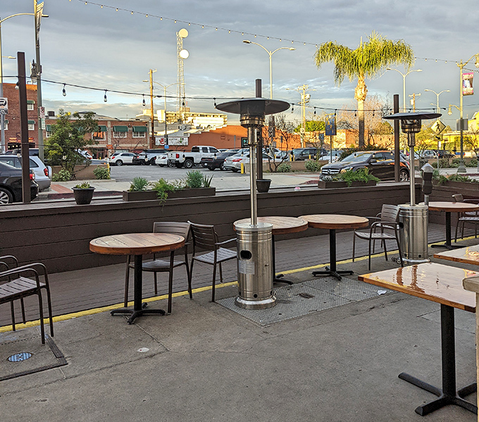 The outdoor patio offers urban al fresco dining where California sunshine meets Italian flavors, with heat lamps standing guard against evening chills.