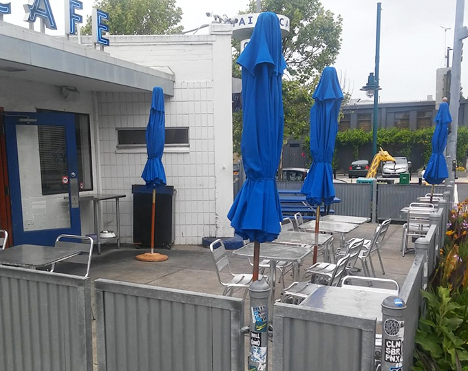 Outdoor seating with bright blue umbrellas for when your pancake euphoria needs fresh air. California dining at its most approachable.