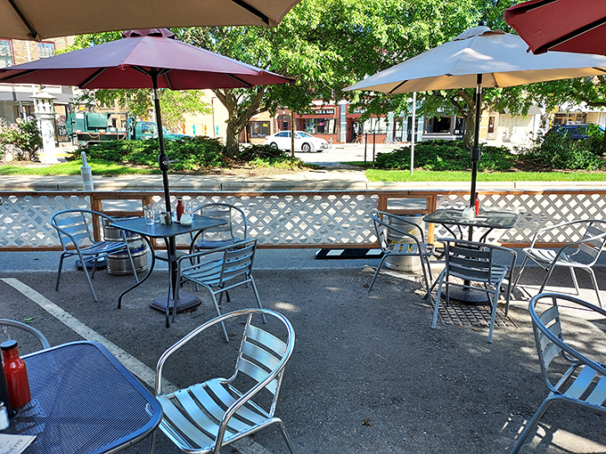 The outdoor patio, where summer afternoons stretch into evening under colorful umbrellas and the clinking of glasses provides the soundtrack.