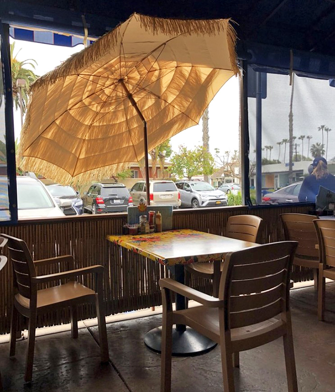 Tiki umbrella shade and ocean breezes make this outdoor spot the perfect perch for people-watching with your pancakes.