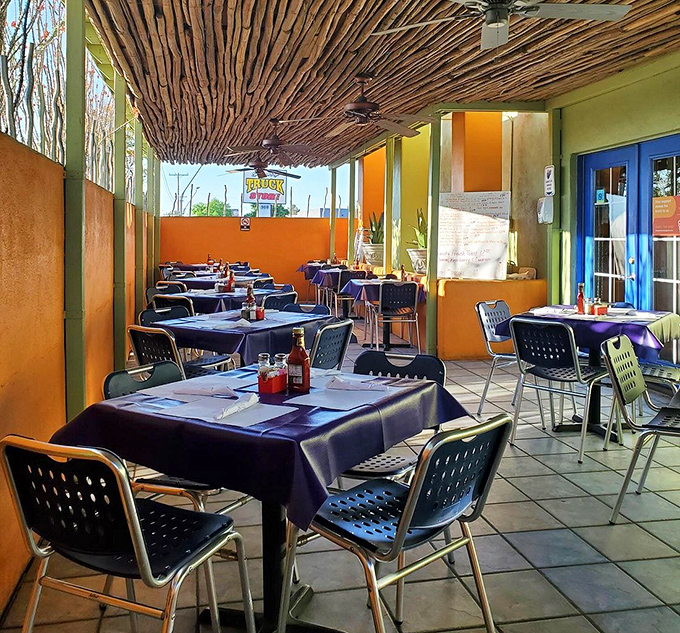 The outdoor patio offers a more subdued color palette but the same commitment to creating a welcoming space for flavor exploration.