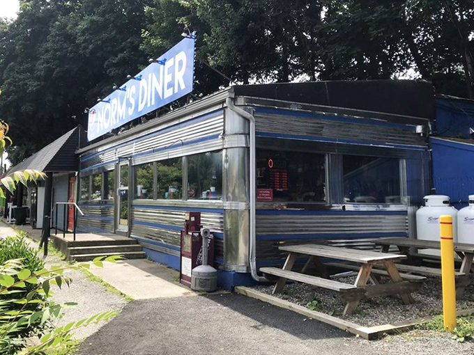 Even the exterior picnic table seems to say, "Why wait? The home fries are calling," as Norm's classic diner profile gleams in the Connecticut sunshine.