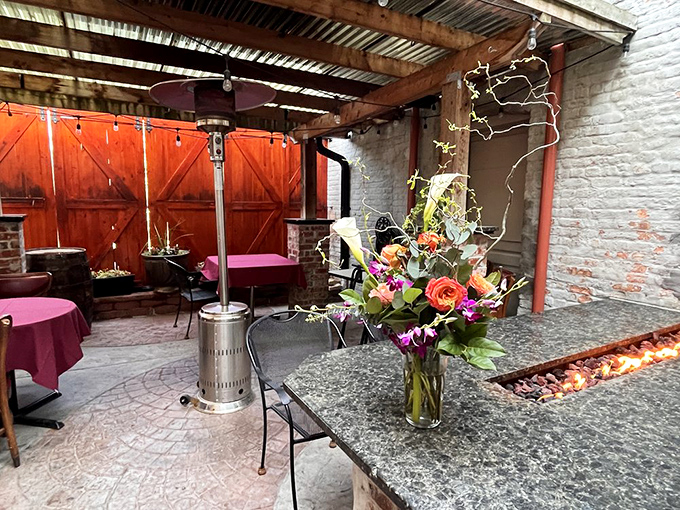 The outdoor patio offers a moment of fresh air between courses. Those barn doors probably have stories that would make your grandmother blush.