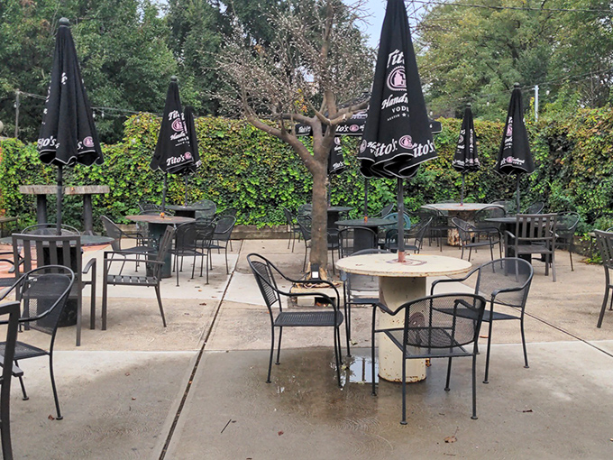 The outdoor patio offers a peaceful retreat where umbrella-shaded tables invite you to linger over that second cup of coffee.
