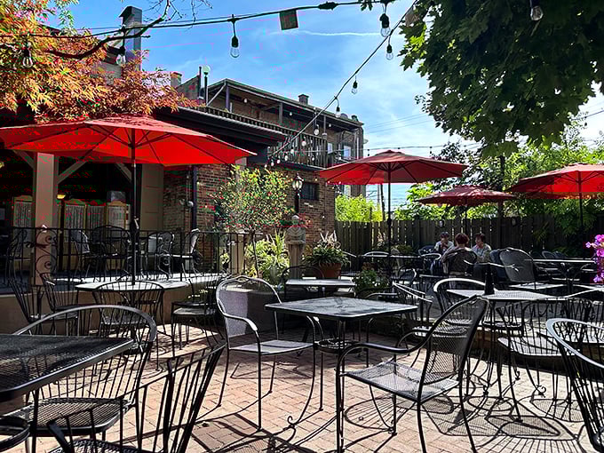 The outdoor patio &ndash; where brick, umbrellas, and string lights create an atmosphere that makes even Tuesday night feel like a special occasion in Italy.