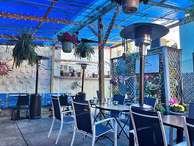 Outdoor seating that feels like dining in a secret garden, where hanging plants and string lights transform coffee into an occasion.