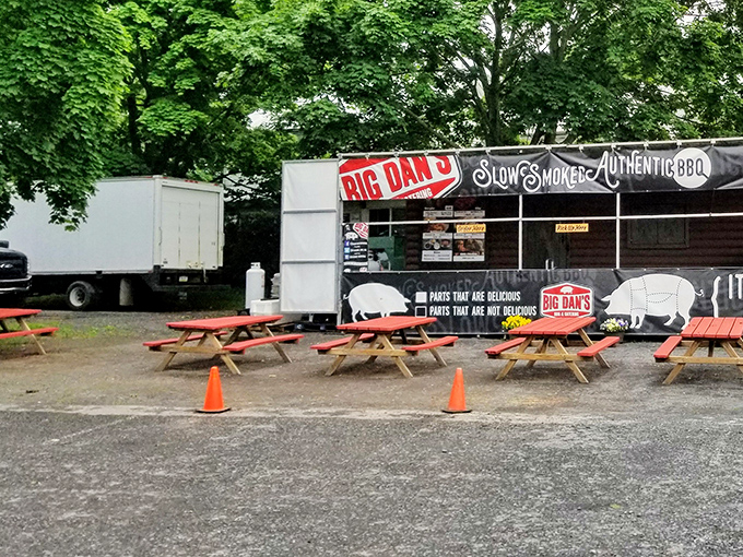 Red picnic tables outside mean summer barbecue season is in full swing—just add sunshine and an appetite.