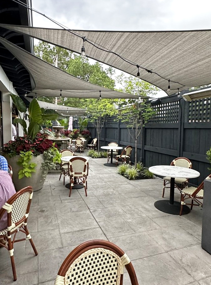 A secluded patio oasis where summer evenings stretch deliciously longer over cocktails and conversation.