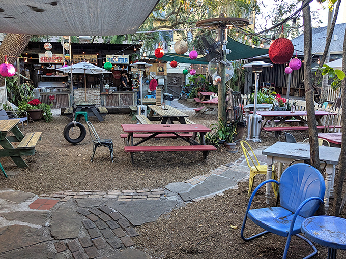 A backyard that feels like summer camp for grown-ups, complete with tire swing and the promise of s'mores (or key lime pie).