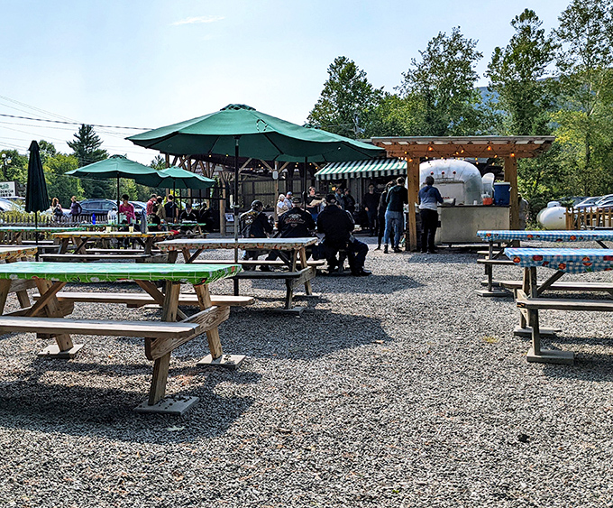 The outdoor seating area&mdash;where picnic tables under green umbrellas offer mountain air as the perfect seasoning for any meal.