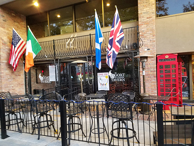 The outdoor patio &ndash; complete with classic red British phone booth &ndash; where Colorado sunshine meets UK pub culture in perfect harmony.