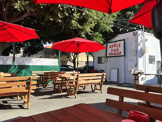 The outdoor seating area feels like a recent concession to modernity, but those red umbrellas provide welcome shade for the burger pilgrimage.