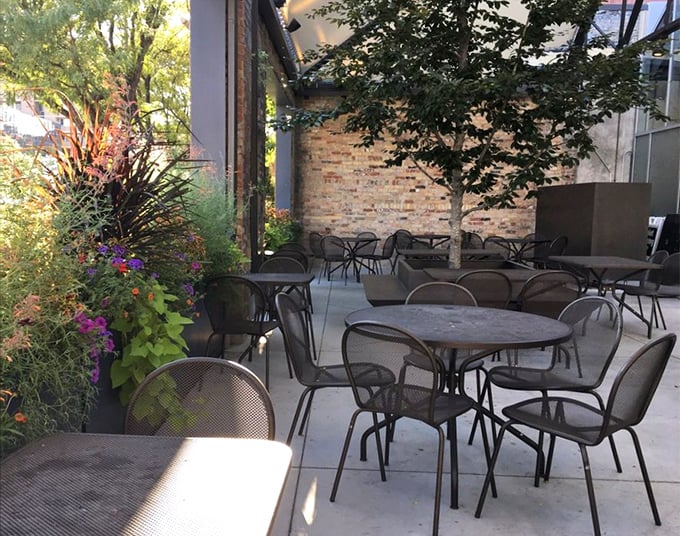 The patio feels like stumbling upon a secret garden party. Those brick walls have stories to tell, preferably over a plate of something that once swam.