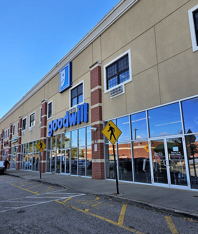 Blue skies frame the Goodwill promise: affordable shopping with purpose. Those pedestrian crossing signs might as well say "Bargains Ahead."