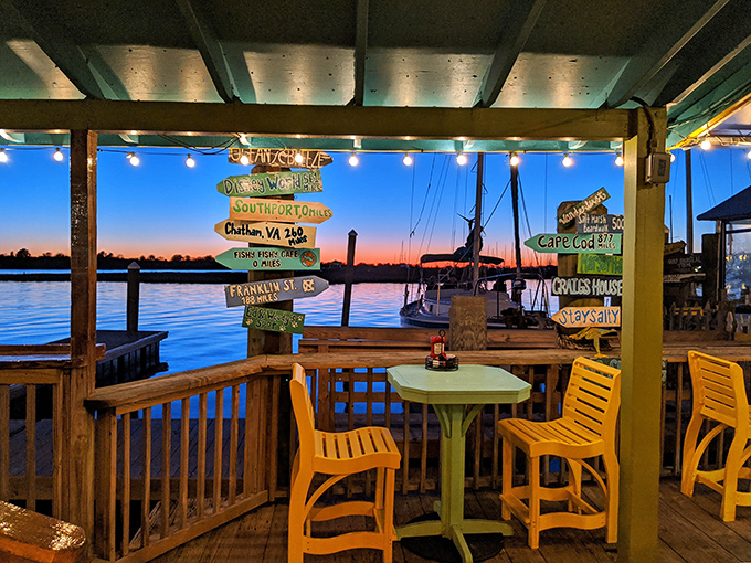 Sunset transforms the deck into pure magic, where colorful directional signs point to places you suddenly feel you need to visit after another cocktail.