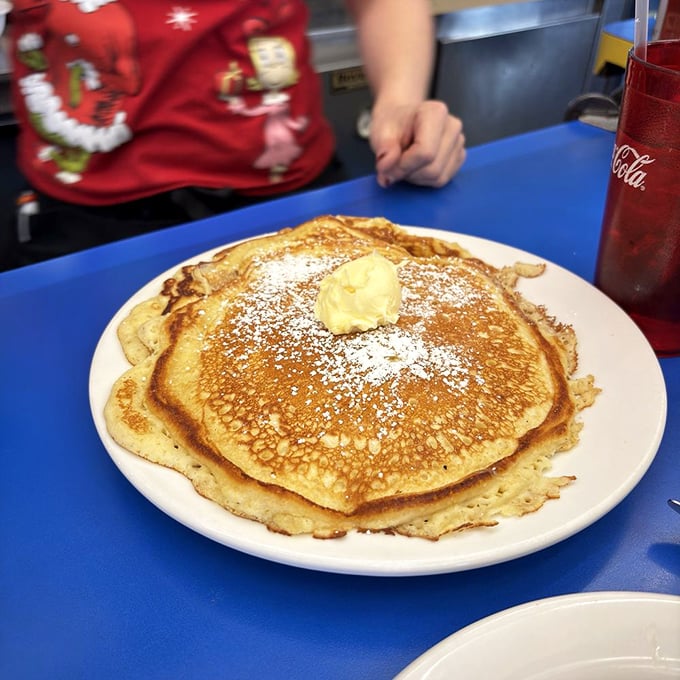 Pancakes so perfectly golden they belong in Fort Knox. That pat of butter melting on top is just showing off.