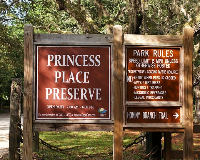 The entrance sign welcomes visitors while gently reminding them this slice of paradise has a few ground rules.
