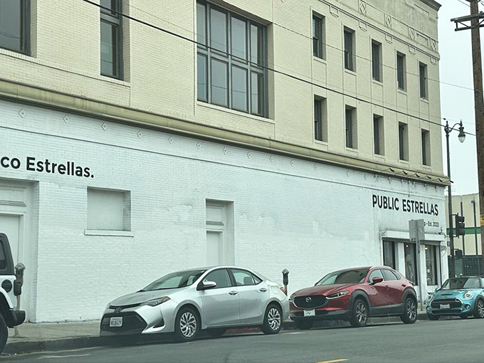 From the street, you'd never guess this unassuming building houses a universe of sartorial possibilities. The best treasures hide in plain sight.