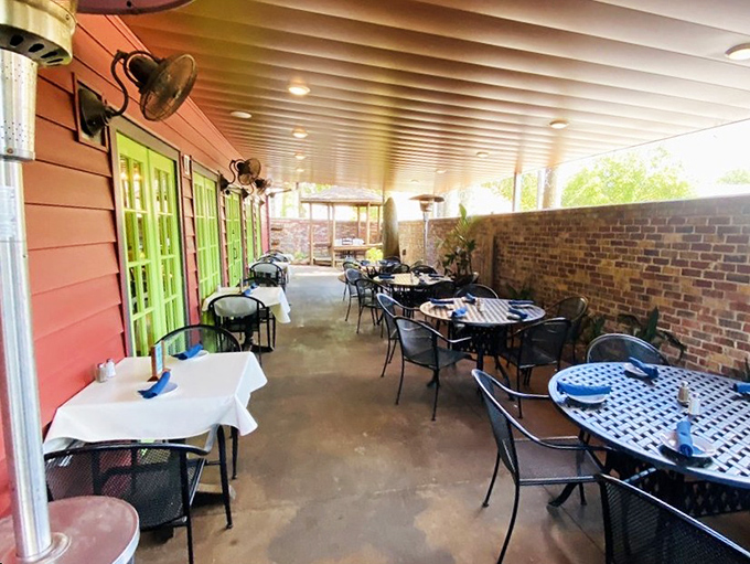 Outdoor seating that lets the Louisiana breeze enhance your meal, with bright green doors that practically wink at passersby.