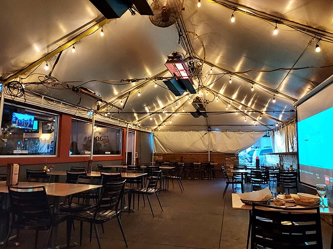 The covered patio offers year-round outdoor dining under twinkling lights&mdash;like eating wings at a casual wedding reception.