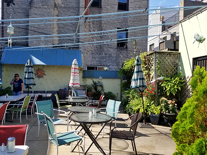The patio offers urban oasis vibes – a secret garden where your breakfast comes with a side of Philadelphia sunshine and gentle breezes.