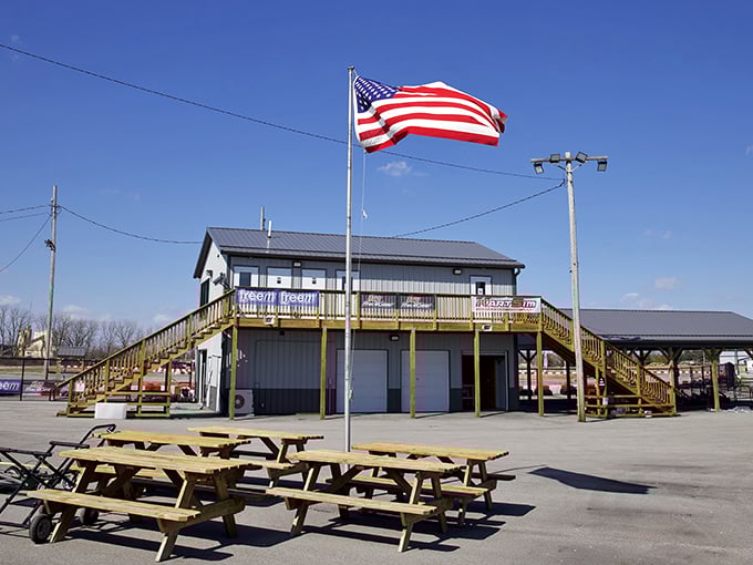 Picnic tables stand ready for post-race debriefings, where near-misses grow more dramatic and lap times mysteriously improve with each telling.