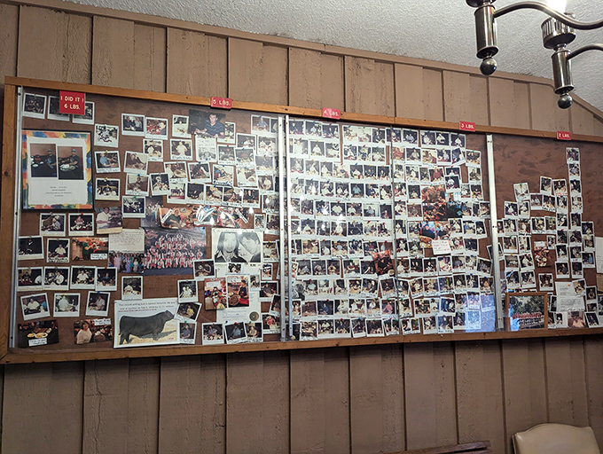 A wall of memories from satisfied customers spanning decades. Each photo represents someone who came hungry and left with a story to tell.
