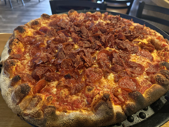 A pepperoni pizza with edges charred to perfection in that brick oven. The crust alone deserves a standing ovation.